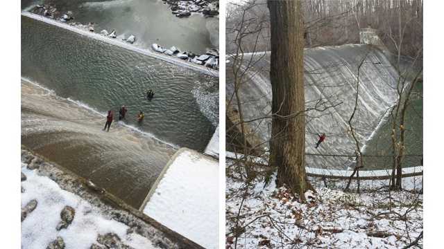 Rescuers free man dangling in rope at dam
