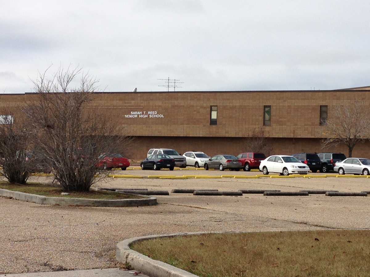 Dozens gather to protest closure of Sarah T. Reed High School